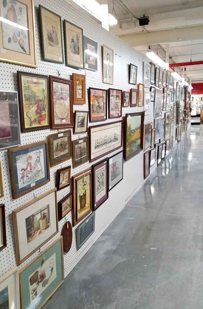 Framed artwork stretches down the wall, offering enough options to redecorate every room in your entire house.
