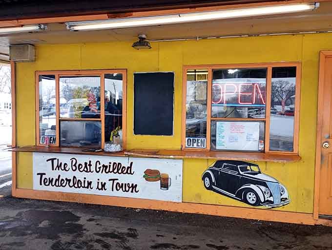 The order window where magic happens, complete with vintage car illustrations that set the nostalgic mood perfectly.