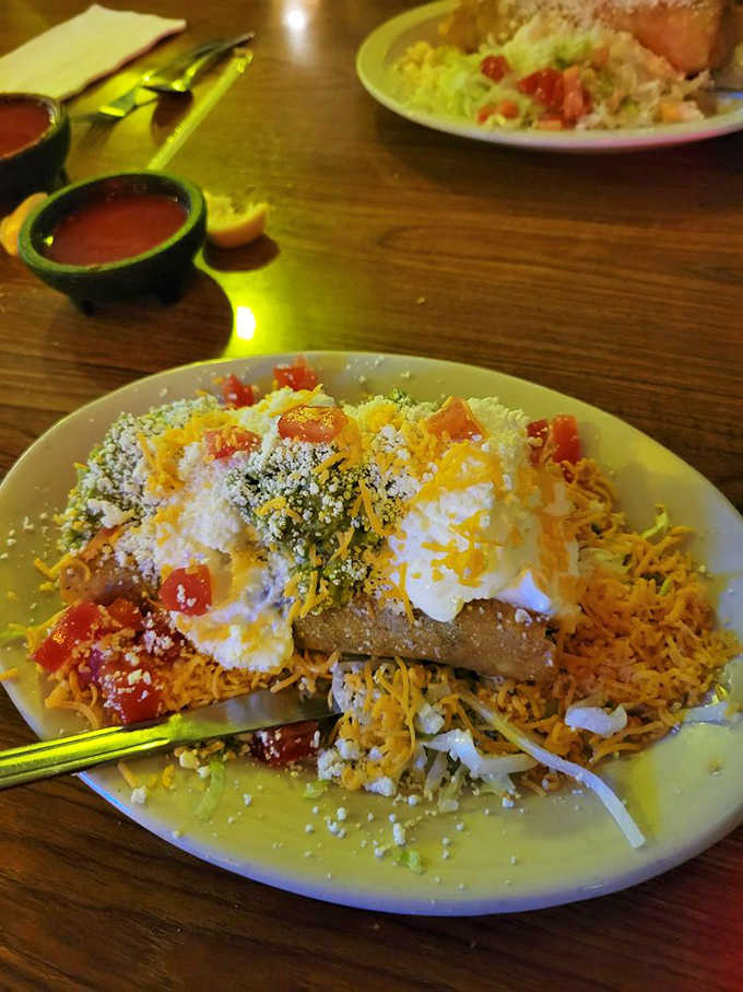 Flautas topped with enough cheese and sour cream to make your cardiologist nervous but your taste buds ecstatic.