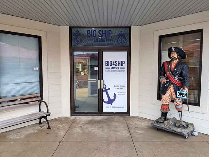 Big Ship Salvage stands ready with its pirate greeter, because every historic town needs at least one delightfully quirky treasure-hunting outpost.