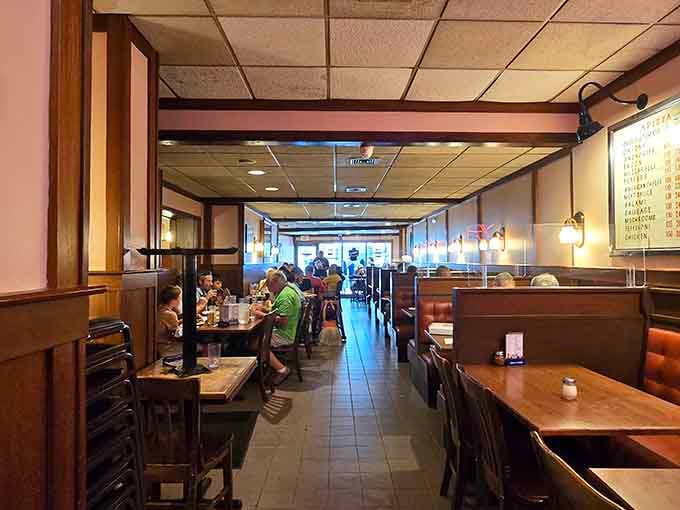 Classic booth seating stretches toward the back, where generations of pizza lovers have settled in for the main event.