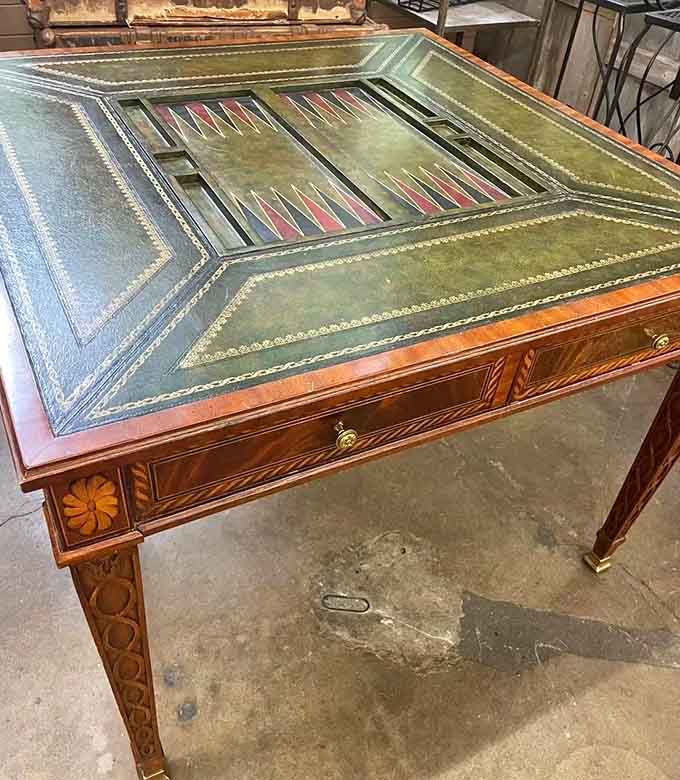 This backgammon table has seen more strategic thinking than most boardrooms, with considerably better craftsmanship throughout.