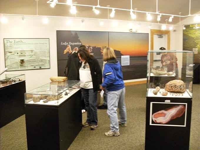 Two visitors discovering that rocks can actually be fascinating when someone explains them with genuine enthusiasm and clarity.