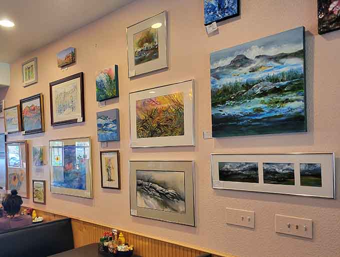The gallery-style wall showcases local talent, turning breakfast into a cultural experience without the museum admission fee.