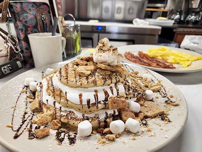 Mini marshmallows and chocolate drizzle transform these pancakes into a campfire memory you can eat with a fork.