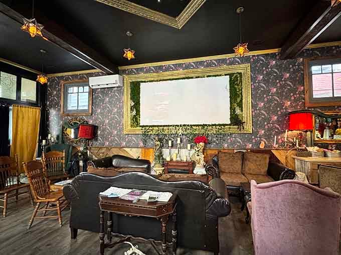 The seating area features a projection screen and cozy furniture, perfect for settling in with your magical beverage.