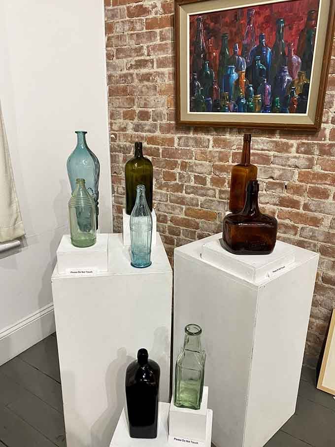 Bottles displayed on pedestals command respect, reminding us these humble containers once held medicines, sodas, and dreams.