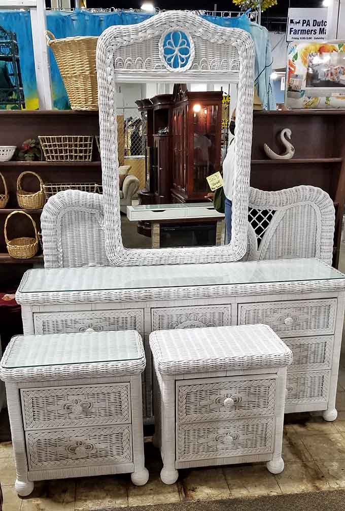White wicker bedroom furniture that screams vintage charm, complete with matching nightstands for your cottage dreams.