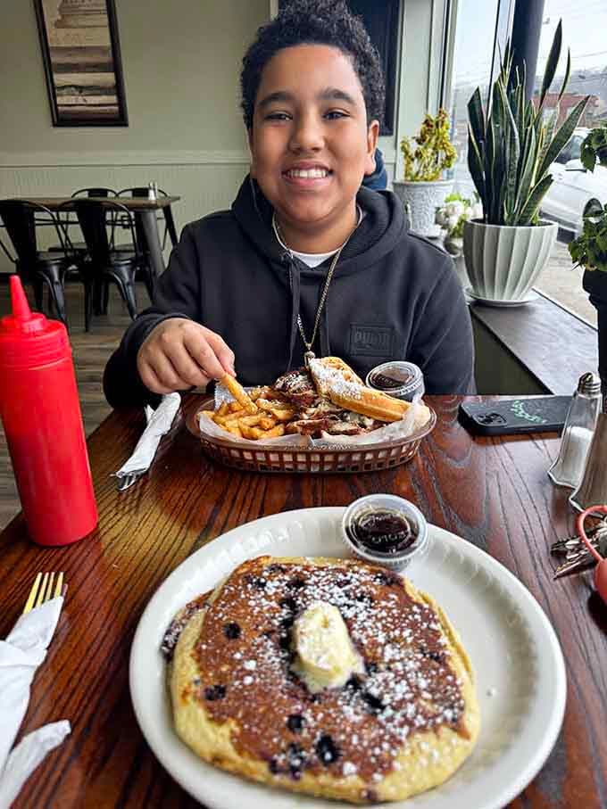 Pure joy captured in one frame, because giant pancakes have that effect on people of all ages.