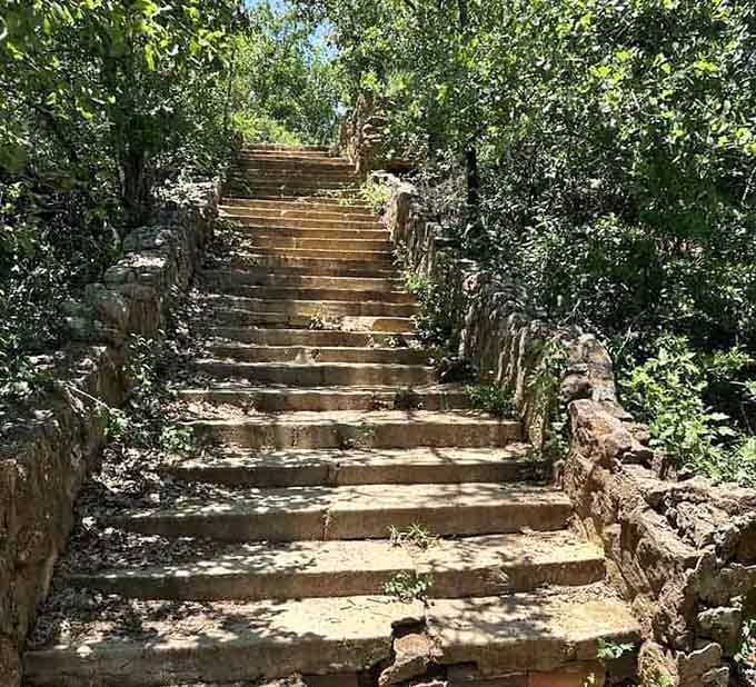 These stone stairs lead upward through the trees, inviting you to climb into history one step at a time.