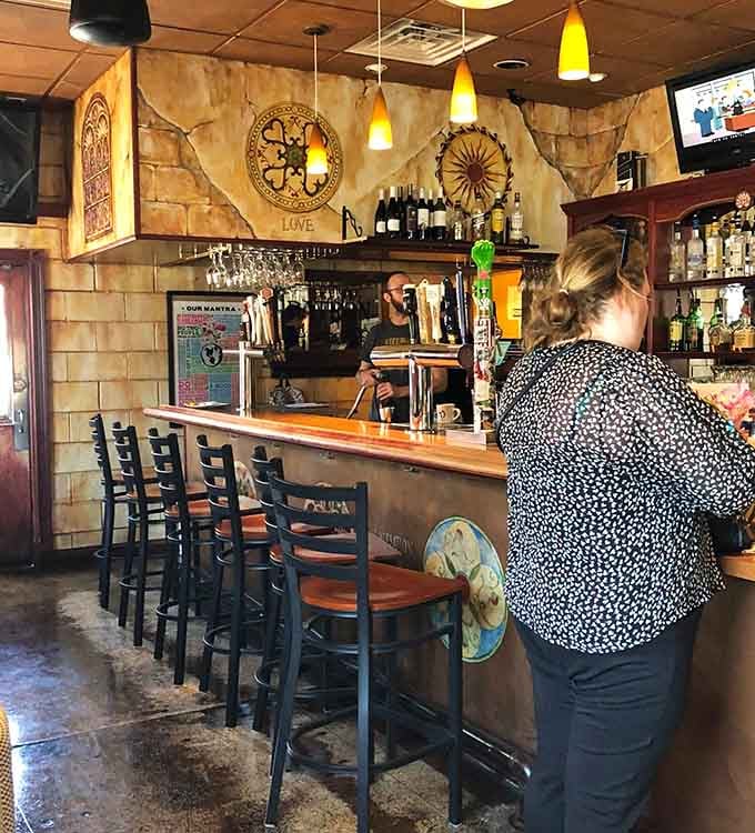 A proper neighborhood bar where locals gather, complete with tap handles and decorative touches that feel authentic.