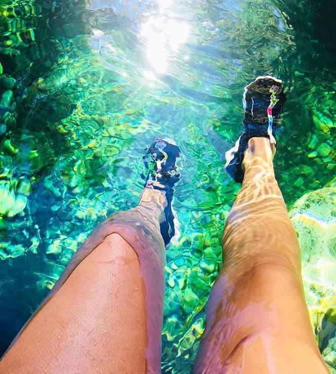 Looking down through crystalline water where your feet appear closer than objects in your rearview mirror.