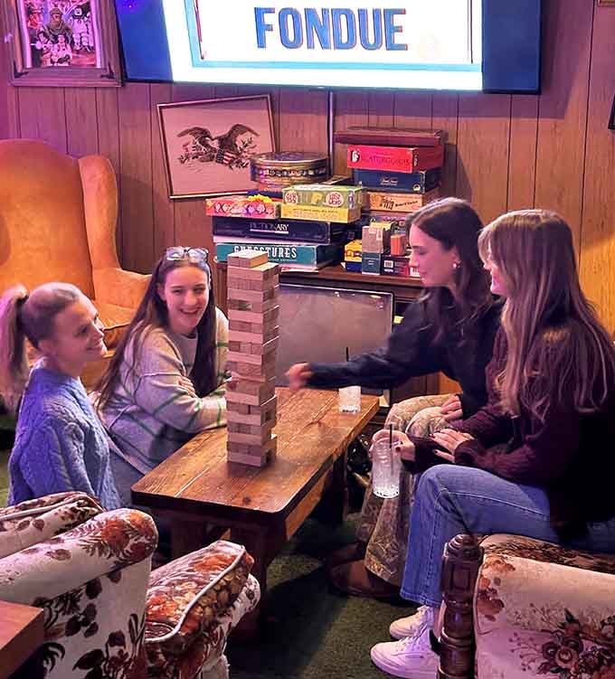 Board games and good company in a cozy corner, perfect for when your thumbs need a break from button mashing.