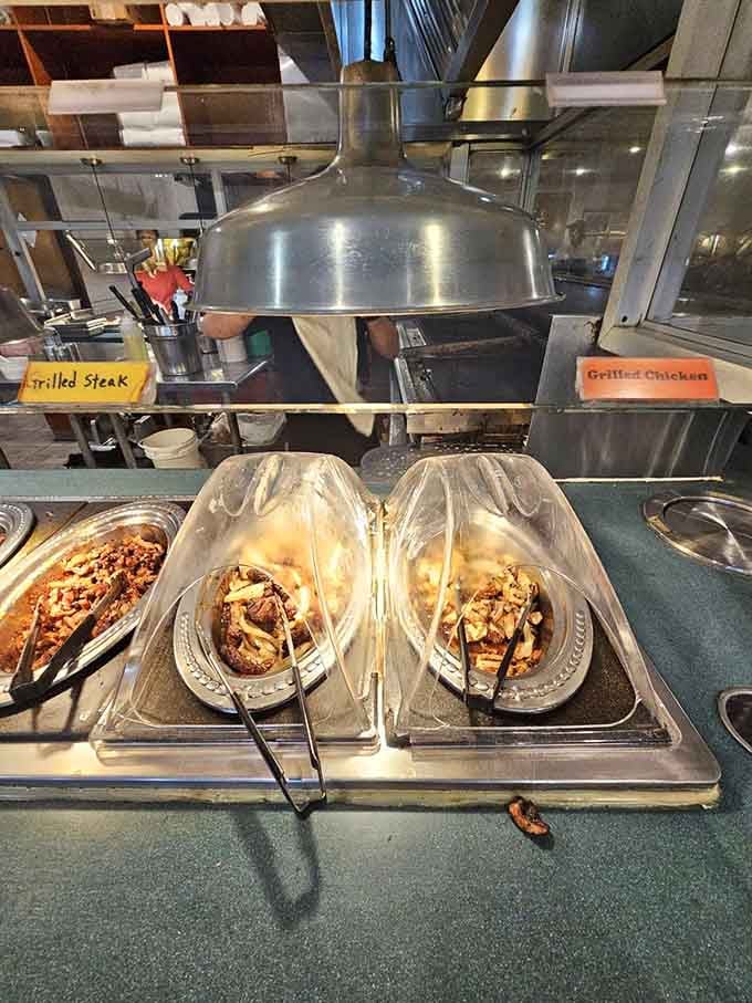 Grilled steak and chicken await your selection, cooked to order rather than languishing under heat lamps forever.
