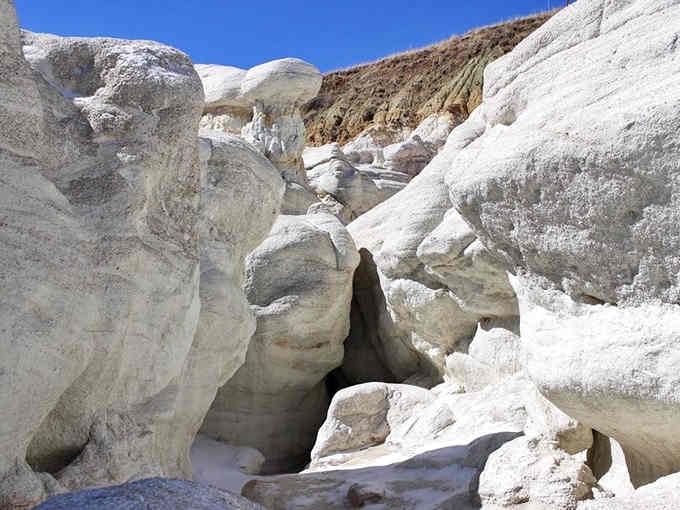 Cream-colored formations creating natural hallways that make you feel like you've wandered onto an alien planet's main street somehow.