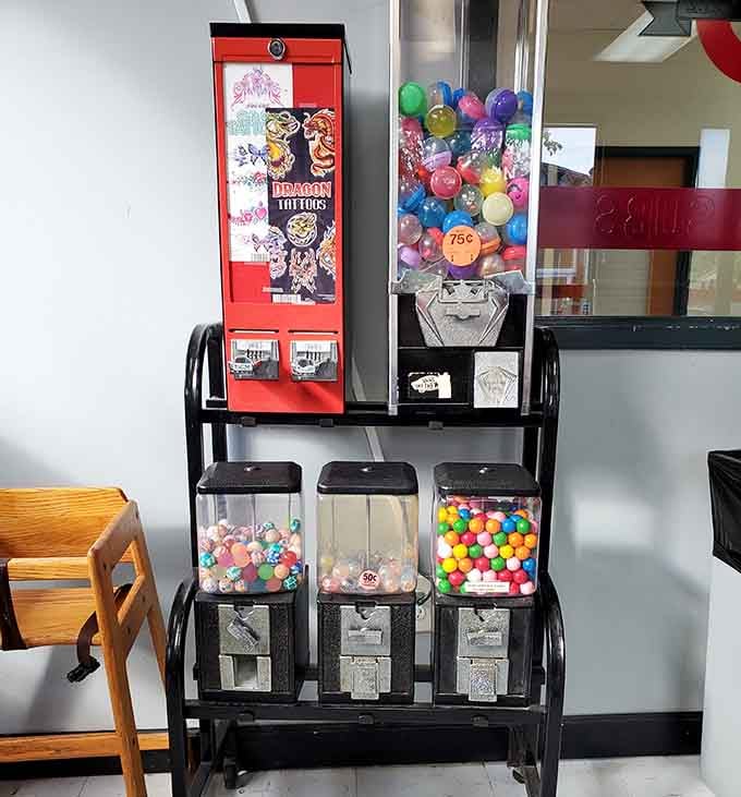 Vintage vending machines offering temporary tattoos and gumballs, because sometimes dinner needs a side of childhood nostalgia and fun.