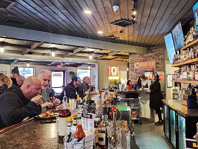 Shoulder to shoulder at the bar, folks dig into their chicken like it's Thanksgiving and nobody's judging portion sizes.