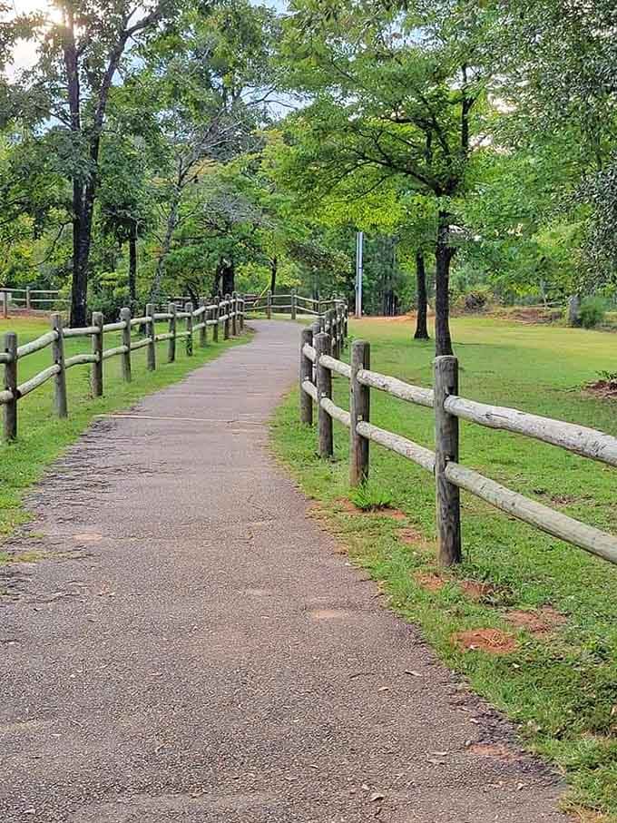 Split-rail fencing guides visitors through peaceful grounds where nature and recreation coexist in perfect harmony.