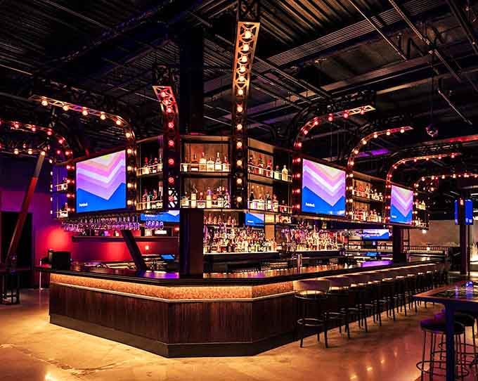 That bar setup means you can fuel your competitive spirit with actual spirits, which seems strategically brilliant.