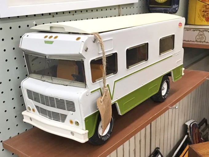 Vintage camper toy ready to roll, capturing that retro road trip spirit without the questionable gas mileage.