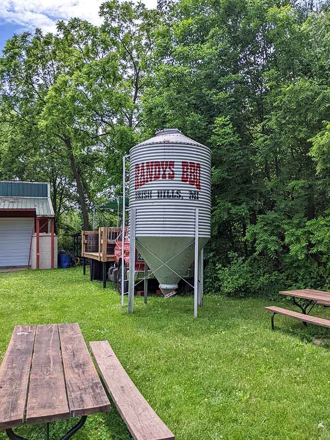 Outdoor seating with a grain silo backdrop, proving Michigan does roadside dining with unexpected rural charm.