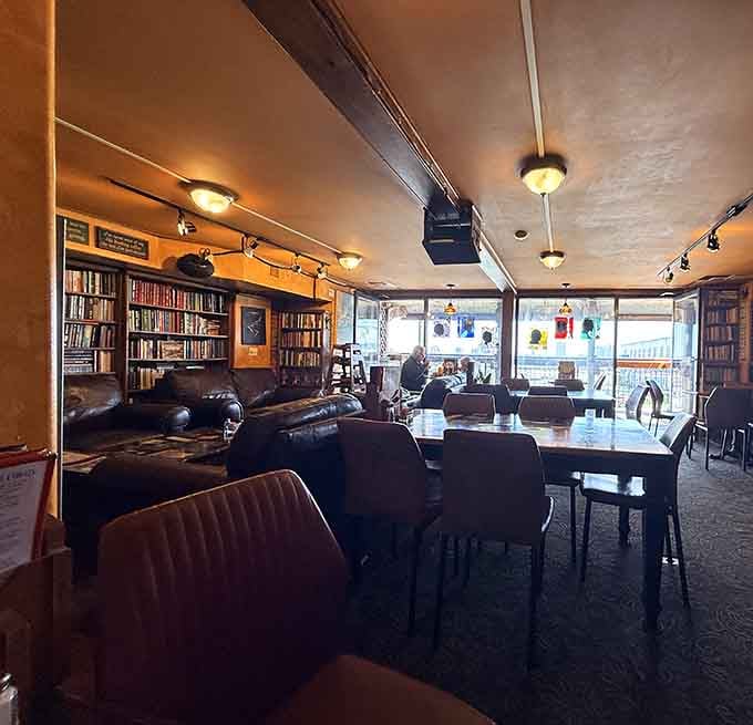 Natural light streaming through those windows onto wooden tables creates the kind of dining space where conversations linger and coffee refills happen.