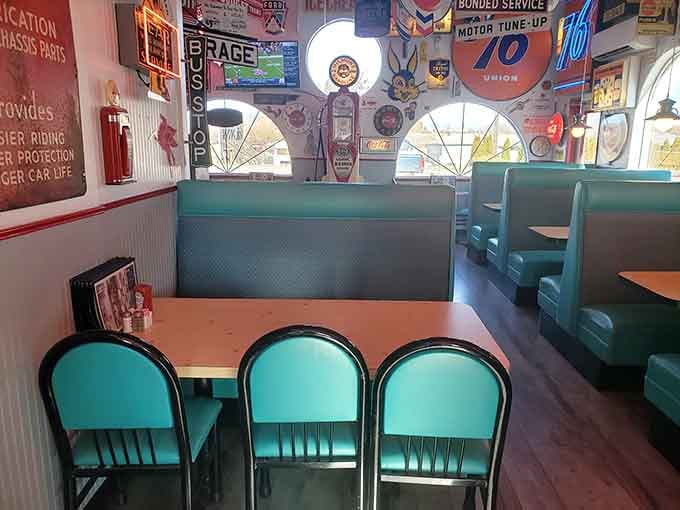 Cozy turquoise booths provide front-row seats to the most entertaining collection of automotive history you'll ever see.