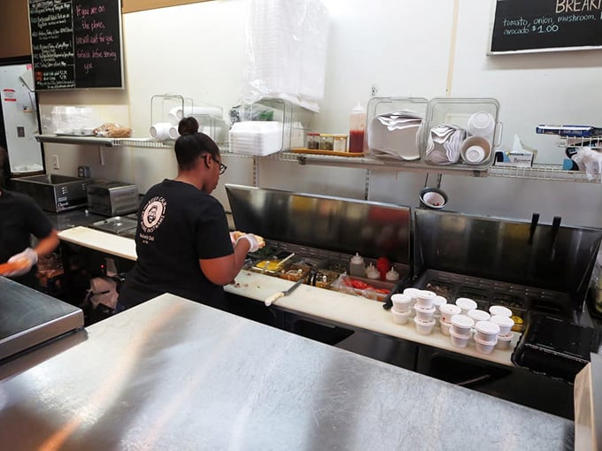 Watch the magic happen as sandwich artists work their craft, assembling edible skyscrapers with practiced precision and care.
