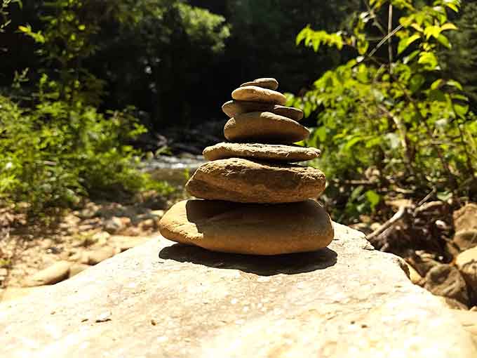 Someone's zen rock tower stands as proof that visitors respect this place enough to leave only art behind.