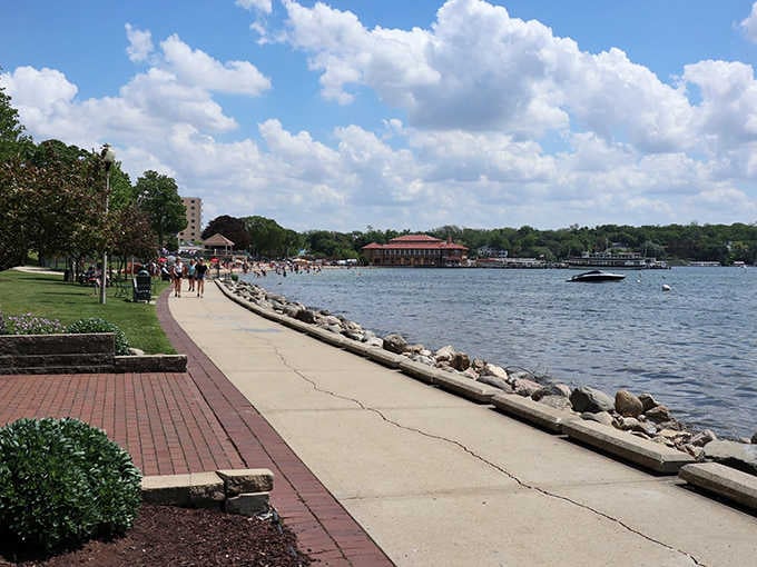 The brick-lined shore path invites leisurely strolls with million-dollar views included at no extra charge.