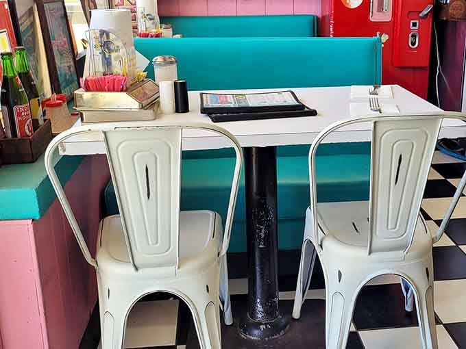 Those white metal chairs and turquoise booths create the perfect spot for contemplating your excellent life choices today.