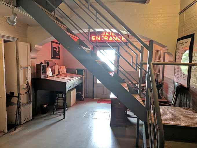 That glowing "Jail Entrance" sign adds an eerie ambiance to the stairway leading to the cells.