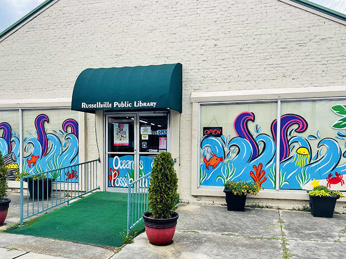 The library's cheerful ocean mural suggests someone had fun with the paint budget and excellent creative freedom.