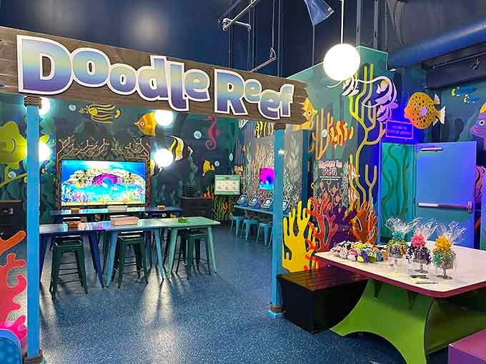 The Doodle Reef interactive area lets kids design their own fish and watch them swim digitally, merging creativity with technology.