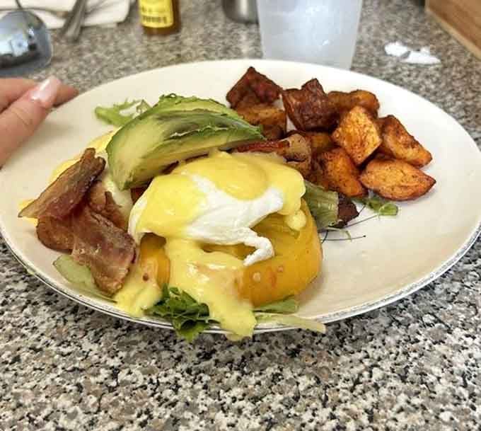 Bacon, lettuce, and tomato meet poached eggs and hollandaise in a combination that rewrites the brunch rulebook entirely.
