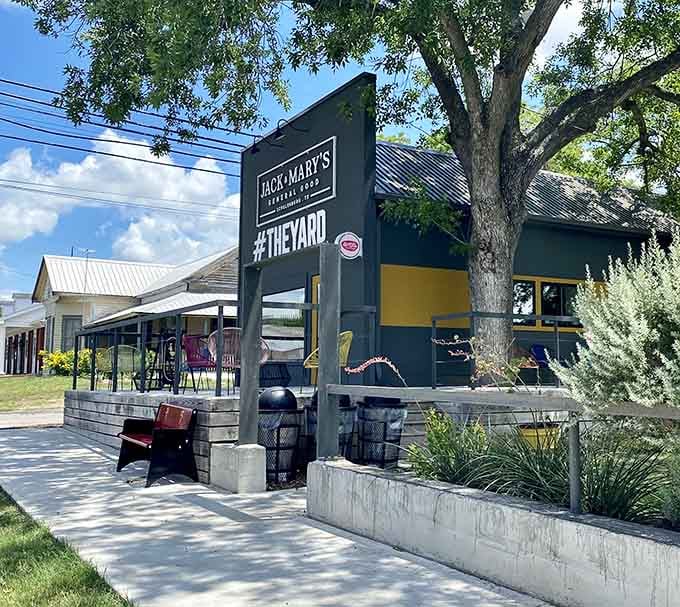 Jack & Mary's outdoor patio under mature trees offers dining where conversation flows easier than in any noisy chain restaurant.