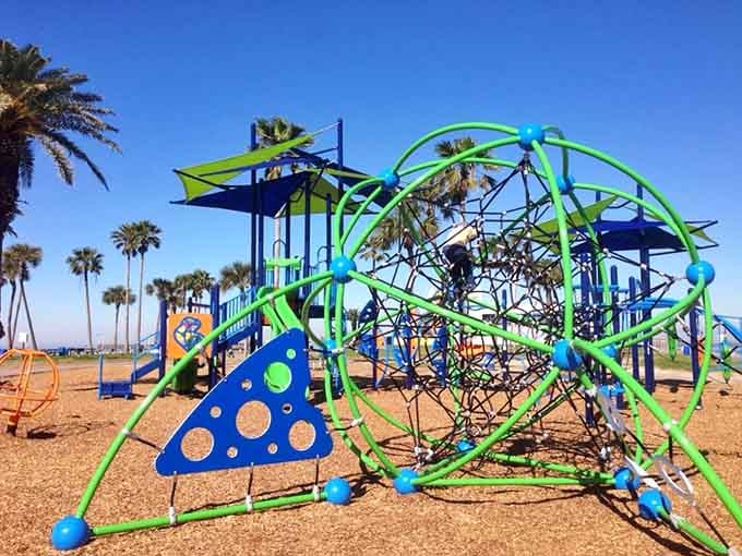 Modern playground equipment ensures younger visitors burn energy while adults contemplate naval history nearby.