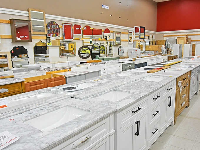 Bathroom vanities stretch endlessly, offering marble-topped solutions for every style preference and budget constraint imaginable.