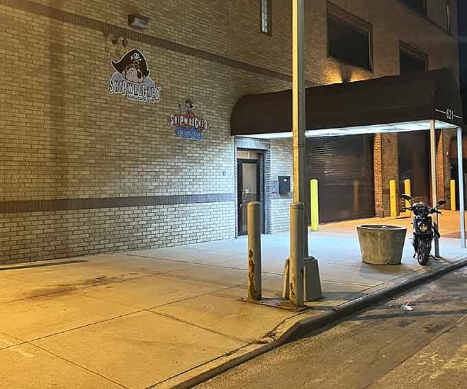 The unassuming exterior on a quiet Brooklyn street hides an entire carnival universe waiting just beyond those industrial doors.