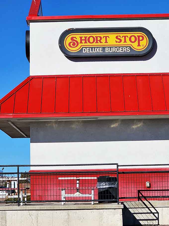 That "Short Stop Deluxe Burgers" sign isn't lying, and your stomach will thank you for believing it.