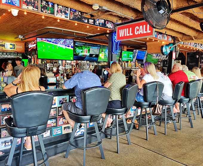 Belly up to this bar where cold beer meets warm conversation and everyone knows the chicken's worth celebrating.