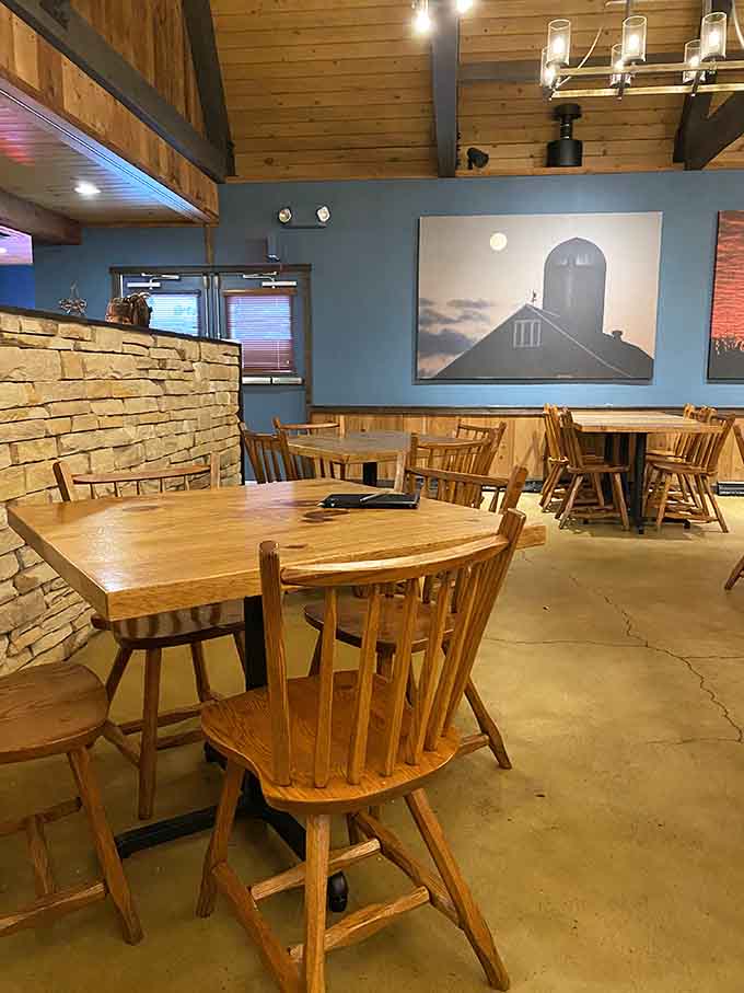 Spacious dining room with exposed beams overhead, because even barbecue joints deserve good bones and character.