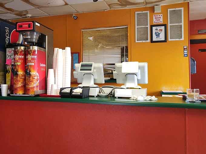 The order counter where dreams of massive sandwiches become delicious reality, one ticket at a time.
