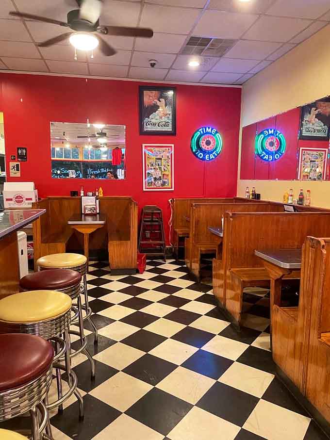 Wooden booths and neon signs create cozy corners where conversations flow as freely as the sweet tea.