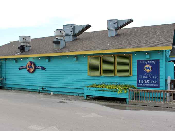 Fishy Fishy Cafe serves seafood in a turquoise building that announces its coastal credentials before you even see the menu.