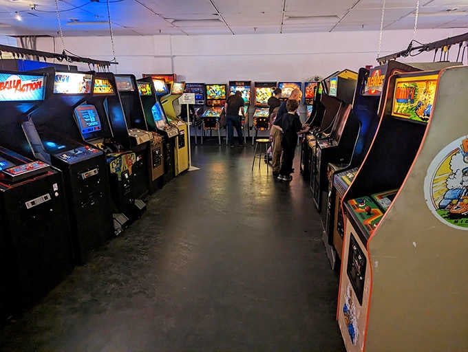 Classic arcade cabinets standing shoulder to shoulder, a lineup that would make any 1980s teenager weep.