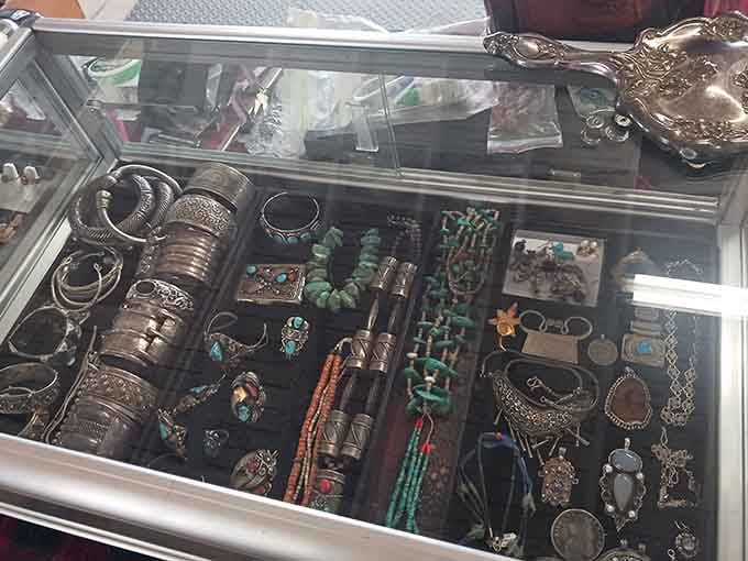 Jewelry glimmers under glass like a treasure chest from your favorite adventure movie, each piece holding its own history.