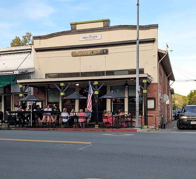 Street-side tables under a vintage storefront prove that some of life's best meals happen in the fresh air.