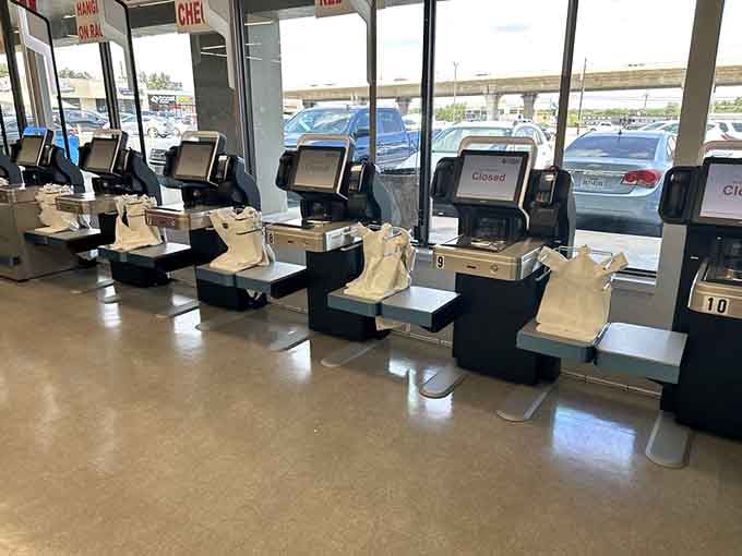 Checkout stations standing ready like pit stops at a shopping marathon, where your cart full of treasures becomes officially yours.