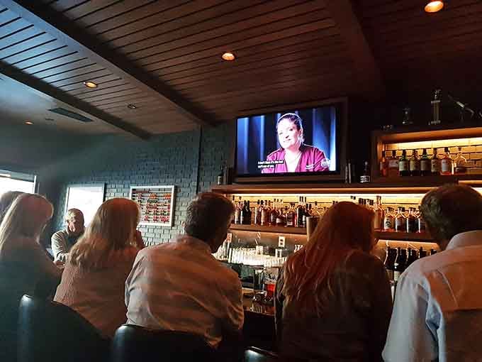 The bar area invites you to settle in with a drink while the TV plays overhead, blending casual and classy perfectly.
